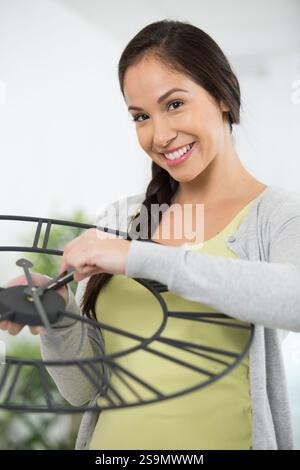 Woman changing clock for daylight saving time at home, closeup Stock ...