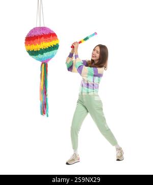 Happy woman breaking colorful pinata with stick on white background ...