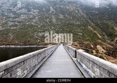 walkway across the top of the ben crom dam and reservoir in the silent ...