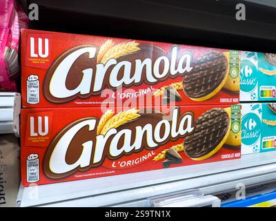 Granola cookies displayed on a supermarket shelf with vibrant packaging ...