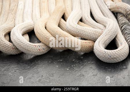 A large rope coiled on a dock Stock Photo - Alamy