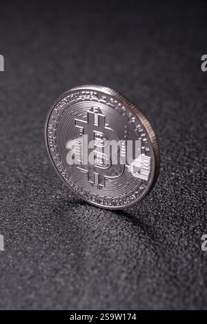 Bitcoin cryptocurrency dummy in the form of a round iron coin ...