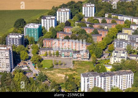High-rise residential apartment buildings with lush rooftops and misty ...