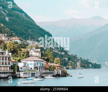 Charming photograph of buildings lining the shores of Lake Como, Italy ...