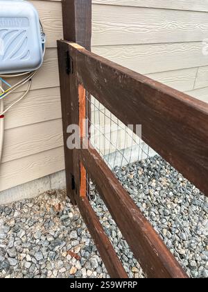 Split rail fence installation with wire mesh Stock Photo - Alamy