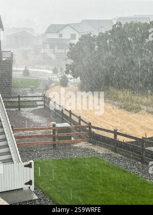Heavy rainfall in residential neighborhood backyard Stock Photo - Alamy