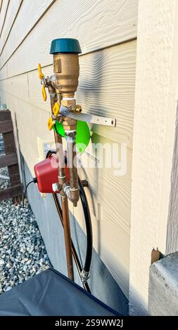 Residential irrigation system backflow preventer outdoors Stock Photo ...