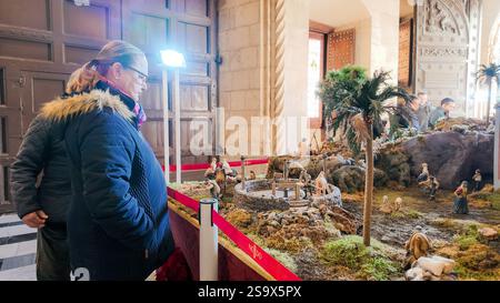 Visitors exploring indoor Nativity scenes, known as Belenes, in Seville ...