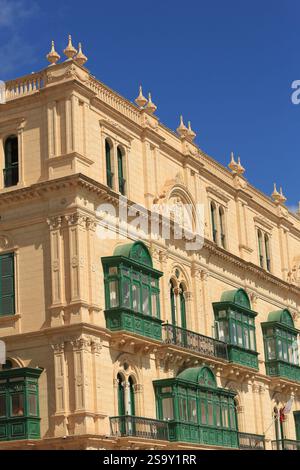 Valletta, Malta. Ornate green balconies on a baroque limestone building ...