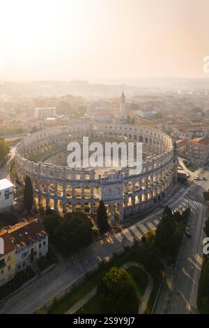 View of the St. Anthony Church and Pula Arena at sunrise. Pula, Istria ...