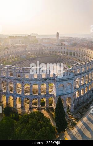 View of the St. Anthony Church and Pula Arena at sunrise. Pula, Istria ...