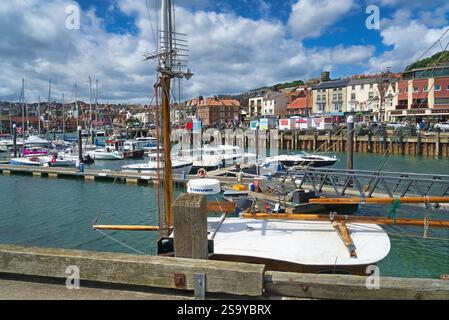 Scarborough harbour, old town, beneath Castle hill. Photograph looks ...