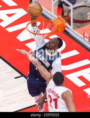Toronto, Canada. 27th Jan, 2025. Toronto Raptors forward Scottie Barnes (4) and New Orleans ...