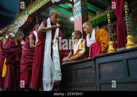 Pilgrims receive rilbu pills at the Empowerment (Wong) during Mani ...