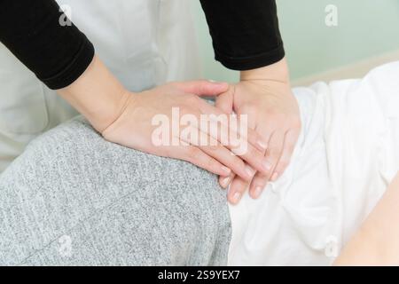 Bodywork, massage, lower back and pelvis Stock Photo - Alamy