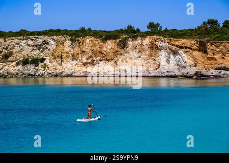 A woman paddles on a SUP board in the Ruhr, bathing, in Muelheim on ...