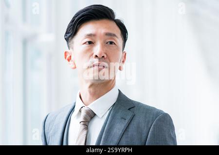 Businessman with anxious expression Stock Photo - Alamy