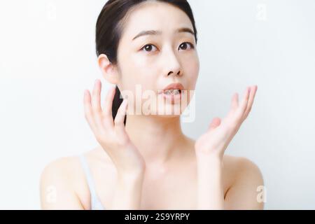 Woman concerned about skin condition Stock Photo - Alamy