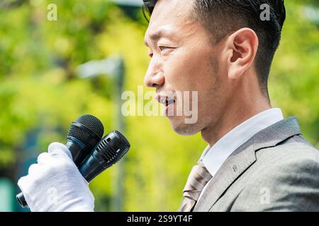 Image of election candidate speaking on the street Stock Photo - Alamy