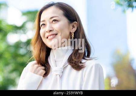 Outdoor portraits of smiling women Stock Photo - Alamy