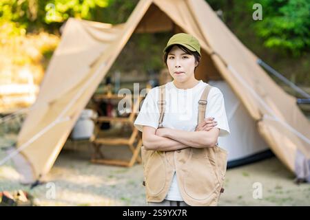 Woman camping solo showing negative emotions Stock Photo - Alamy