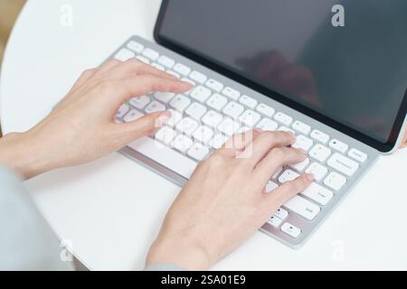 Woman's hand on computer keyboard Stock Photo - Alamy