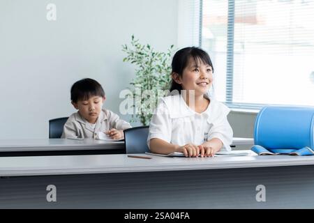 Primary schools student in class Stock Photo - Alamy