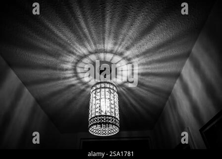 Electric ceiling light casting shadow shapes Stock Photo - Alamy