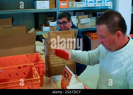 Disabled workers working in the ESAT product packaging workshop Stock ...