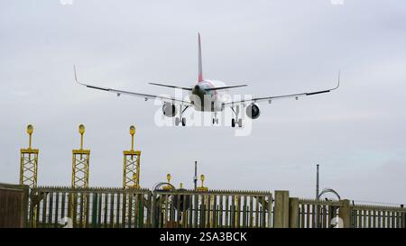 Under the Wings: A Glimpse of the Landing Approach Stock Photo - Alamy