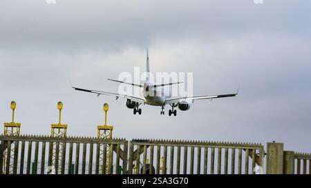 Under the Wings: A Glimpse of the Landing Approach Stock Photo - Alamy