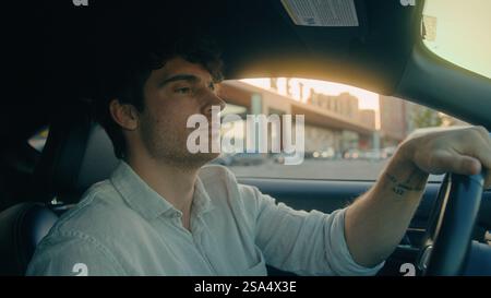 Man driving a luxurious vehicle Stock Photo - Alamy