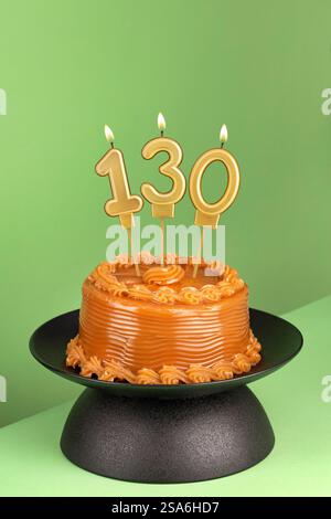 Birthday number 130 - Green birthday candle on white background Stock ...