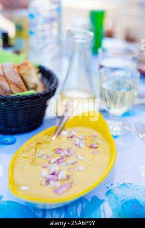 Authentic greek fava dish served with octopus and white wine for lunch ...