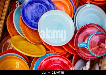 Colorful small dishes in ceramic factory in Italy Stock Photo - Alamy