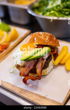 Gourmet beef burger topped with egg and onion Stock Photo - Alamy