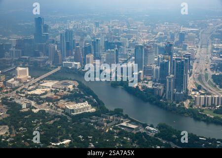 Aerial view downtown Austin with trees and highway bordering Town Lake ...