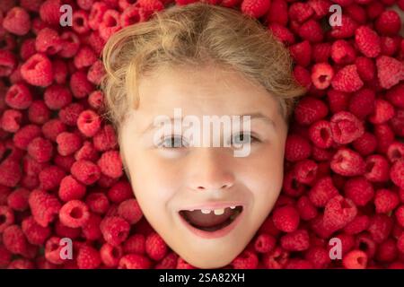 Raspberry isolated. Raspberries child face close up. Top view photo of ...
