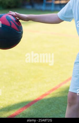 Basketball close-up on black background with bokeh, spotlights and fire ...