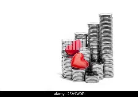 Fiery red hearts on towers of silver coins. Valentine's Day, banner ...