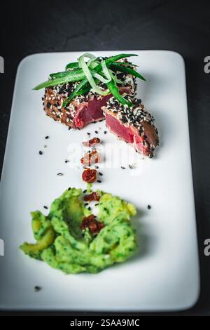 Cooked tuna steak in sesame with vegetables.Fish steak Stock Photo - Alamy