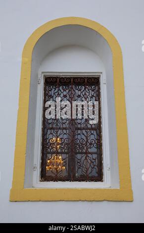 Mountain village Lakkoi with Agios Antonios church, church window ...