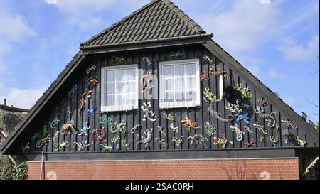 Facade decoration of the roof gable with natural wood plank of a new ...