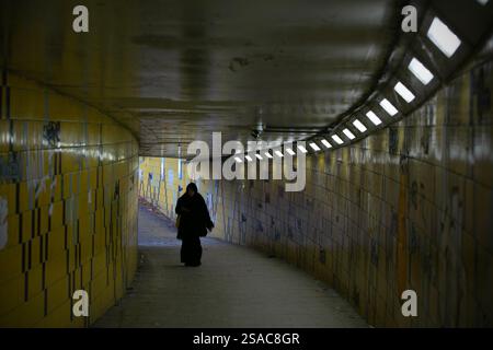 A woman walks along a run-down subway underpass in Leeds city centre ...
