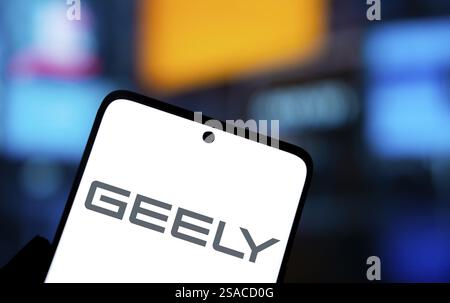 Geely logo is displayed on smartphone. Zhejiang Geely Holding Group Co ...
