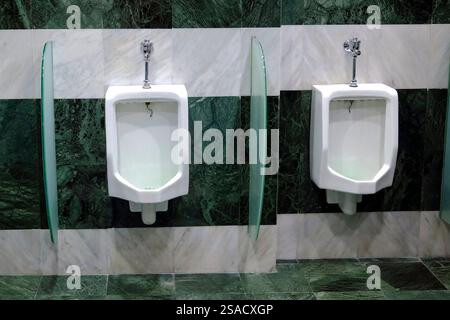 Row of white urinals in men toilet room Stock Photo - Alamy