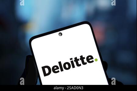 Deloitte logo is displyed on smartphone. Deloitte is a multinational ...