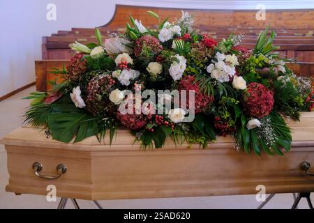 Flowers at the coffin, farewell to a dear deceased. Funeral service in ...