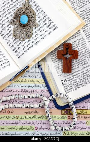 Bible, Quran and Torah with symbols of religions. Concept of interfaith ...