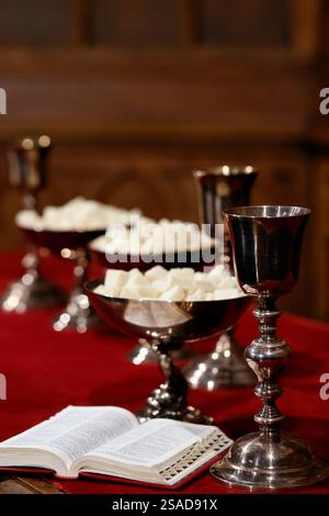 Protestant church. Bible, vine and bread on altar. Communion in memory ...